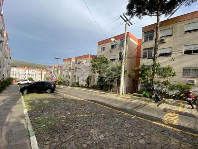Apartamento à venda em Porto Alegre RS, bairro Santa Tereza: 2 quartos, 1 sala, 2 vagas de garagem
