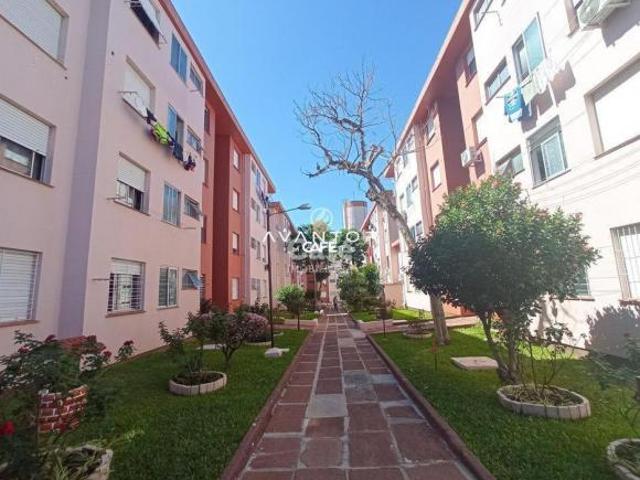 Apartamento amplo de 3 dormitórios, sala de estar, cozinha, e estacionamento