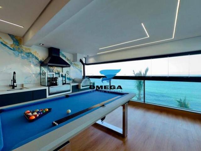 Apartamento beira mar à venda na praia das Pitangueiras no Guarujá I Omega Imoveis
