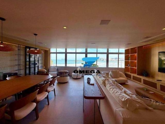 Apartamento beira mar reformado à venda na praia das Pitangueiras no Guarujá I Omega Imoveis