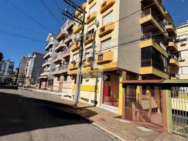 Apartamento central, 2 dormitórios com vaga