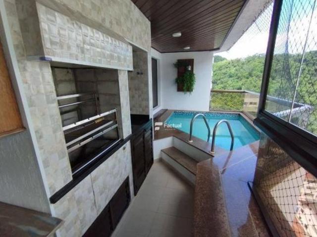 Apartamento com 3 dormitórios à venda, 135 m² por R$ 900.000,00 Pitangueiras Guarujá/SP
