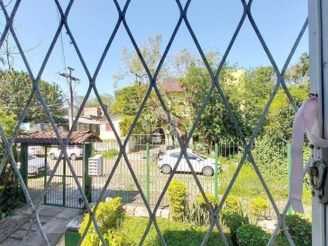 Apartamento com 3 dormitórios/quartos e gararagem no bairro Jardim Botânico