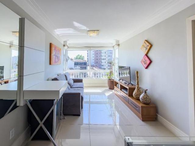 Apartamento com 2 dormitórios, 1 suíte e 1 vaga de garagem no bairro Cristo Redentor
