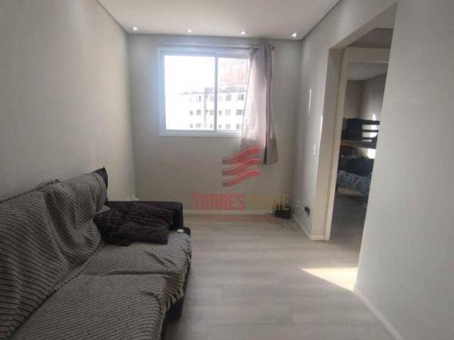 Apartamento com 2 dormitórios à venda, 54 m² por R$ 310.000,00 Areia Branca Santos/SP