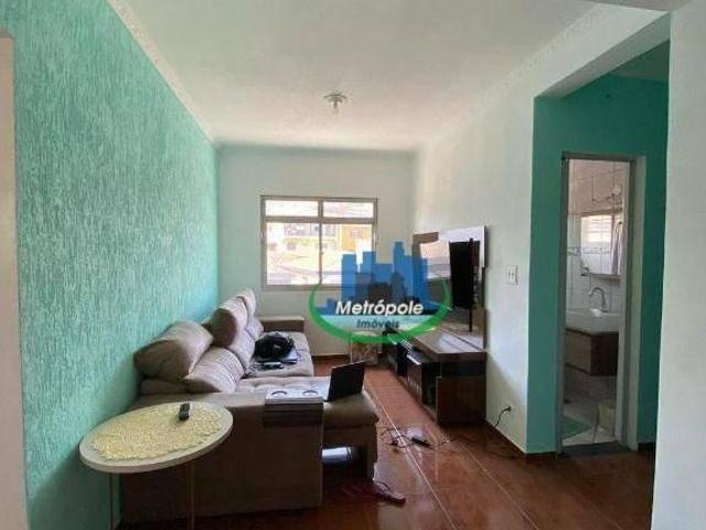 Apartamento com 2 dormitórios à venda, 70 m² por R$ 318.000,00 Cocaia Guarul