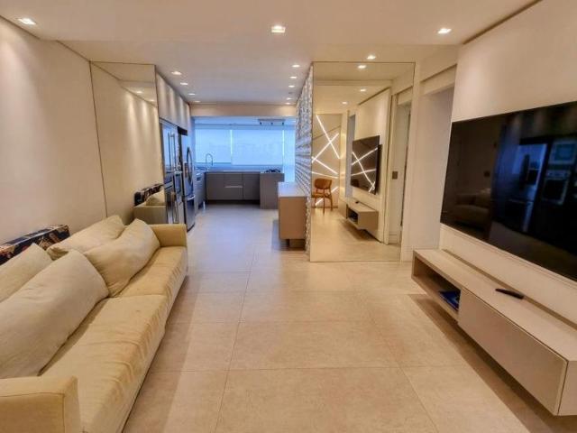 Apartamento com 2 dormitórios, com 2 vagas de garagem, 87 m², à locação por R$ 15.000,00 Bertioga/SP, Riviera de São Lourenço, Módulo: 5