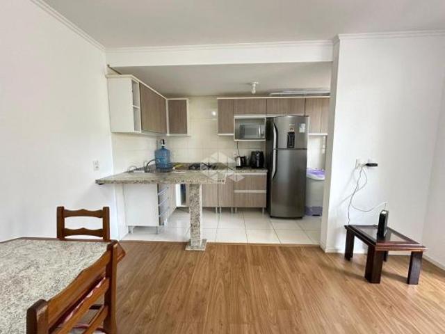 Apartamento com 2 dormitórios e 1 vaga no centro