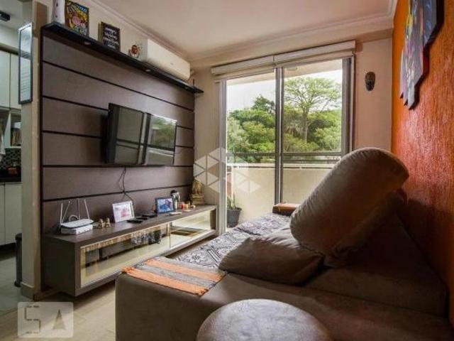 Apartamento com 2 dormitórios, sacada, churrasqueira com garagem no bairro Morro Santana
