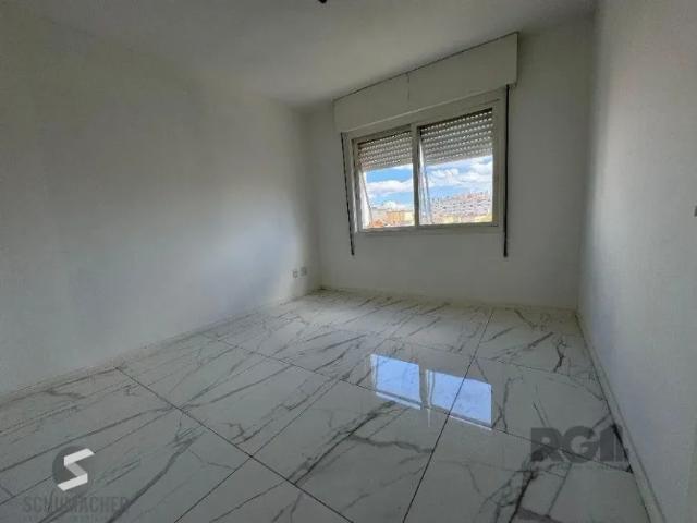 Apartamento com 54,70 m² de área privativa com dois dormitórios, sala, cozinha e área de serviço. Re