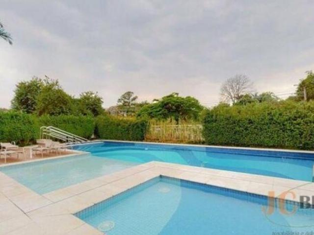 Apartamento com 73m² de área útil, 2 dormitórios sendo 1 suíte, living, varanda, 2 vagas
