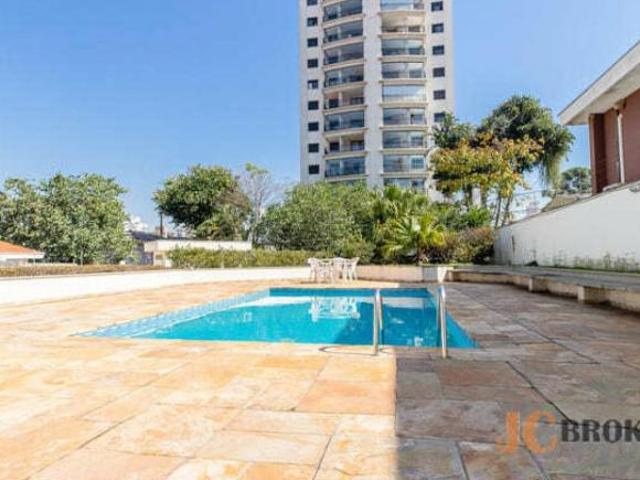 Apartamento com 90m² de área útil, living, varanda, 1 vaga de garagem, 2 dormitórios