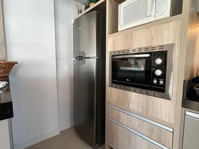 Apartamento com três dormitórios em Torres