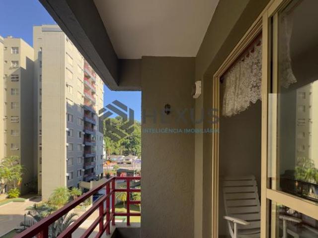 Apartamento com varanda e lazer na Praia da Enseada, Guaruja