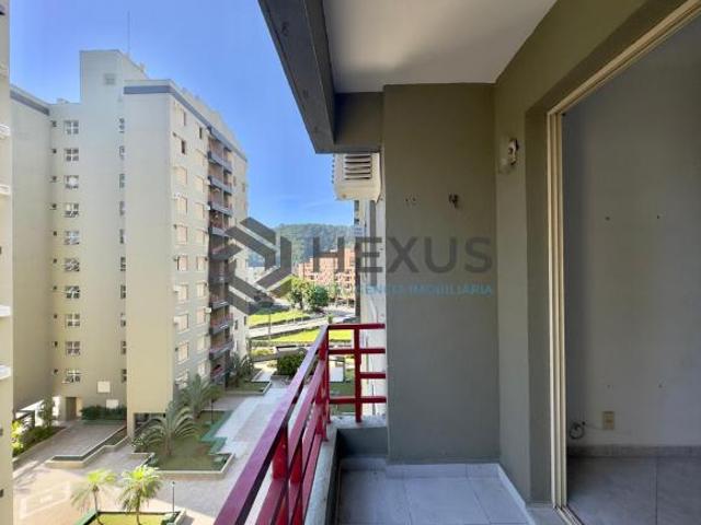 Apartamento com varanda e lazer na Praia da Enseada, Guaruja
