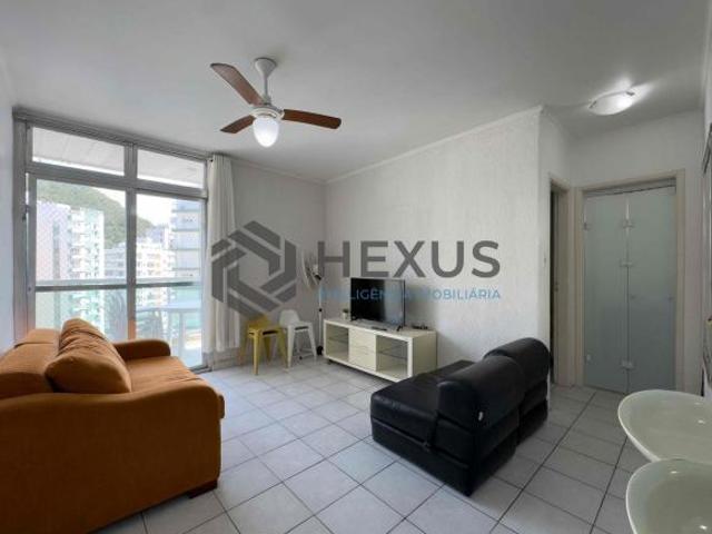 Apartamento com varanda e vista mar na quadra mar da Praia das Pitangueiras, Gua