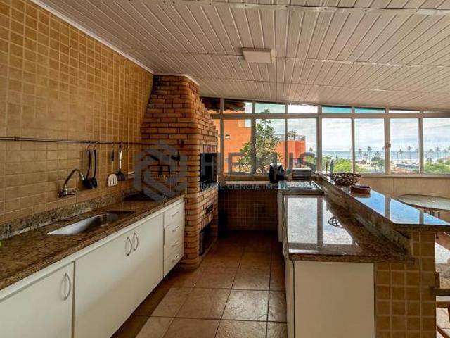 Apartamento com varanda gourmet vista mar e lazer a 300m da praia na Enseada, Gu