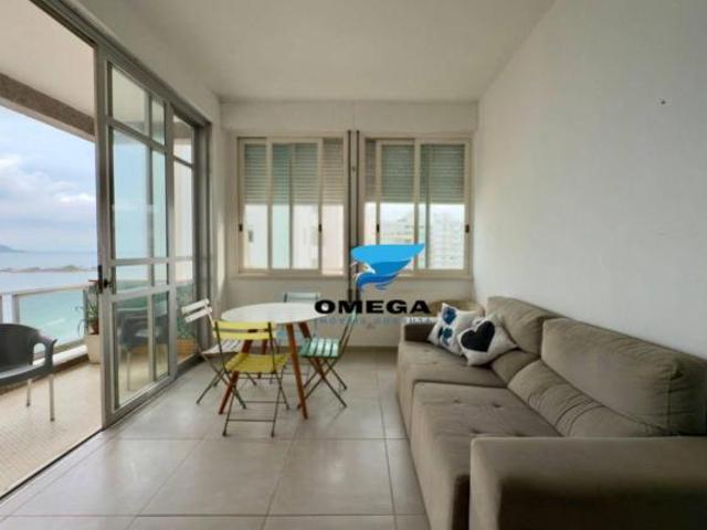 Apartamento com vista mar à venda na praia das Pitangueiras no Guarujá I Omega Imoveis