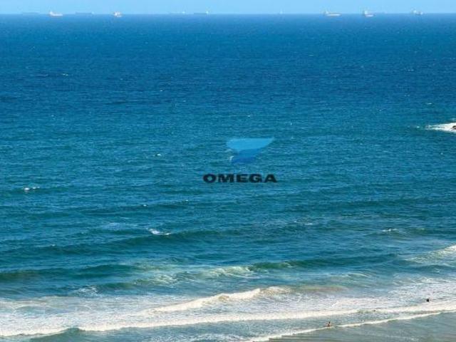 Apartamento com vista mar à venda na praia das Pitangueiras no Guarujá I Omega Imoveis