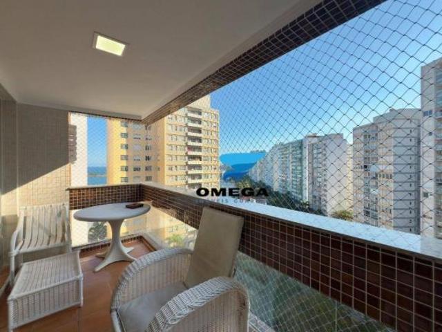 Apartamento com vista mar à venda na praia das Pitangueiras no Guarujá I Omega Imoveis