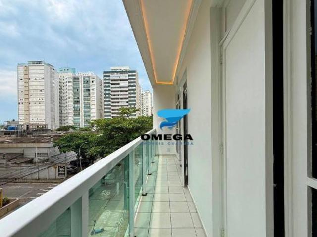 Apartamento com vista parcial para o mar à venda na praia das Pitangueiras no Guarujá I Omega Imovei