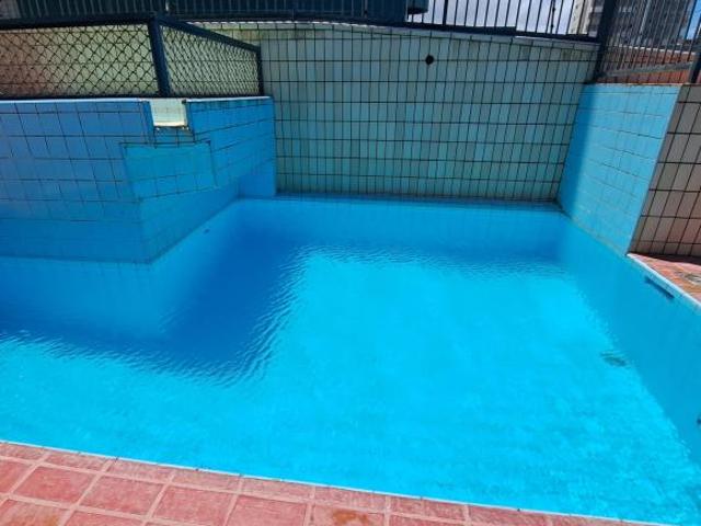 Apartamento com vista para o mar e varanda, 2 quartos, 1 sala e cozinha ampla