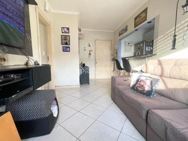 Apartamento de 1 dormitório no Edifício Flor do Campo, com ambientes bem distribuídos, ótima ilumin