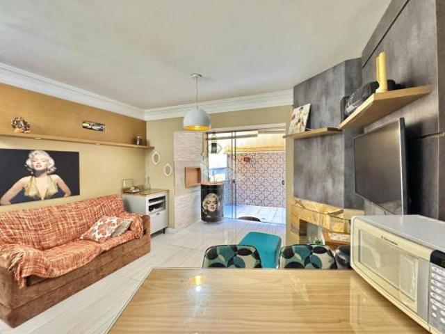 Apartamento de 1 dormitório c/ terraço mobiliado e com box de garagem no Centro de Capão da Canoa