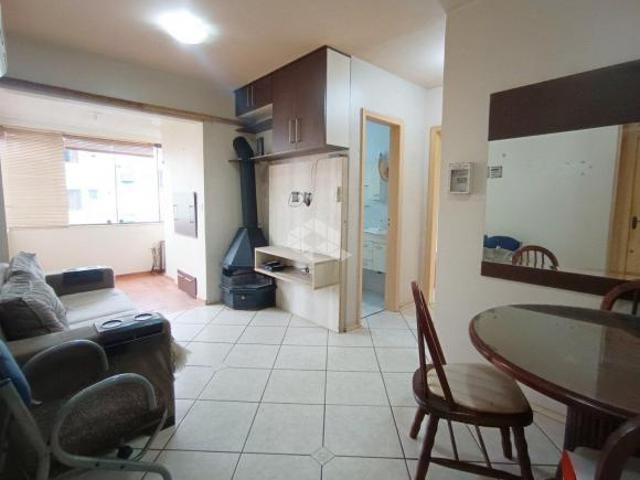 APARTAMENTO DE 1 DORMITORIO COM SACADA, CHURRASQUEIRA E VAGA