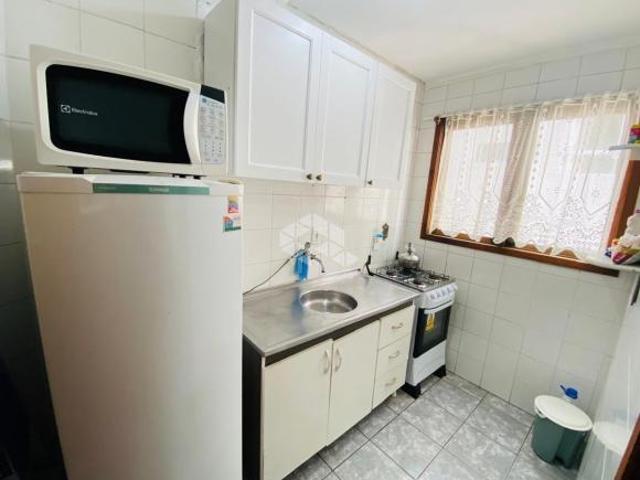 Apartamento de 1 dormitório mobiliado c/box de garagem em Capão da Canoa