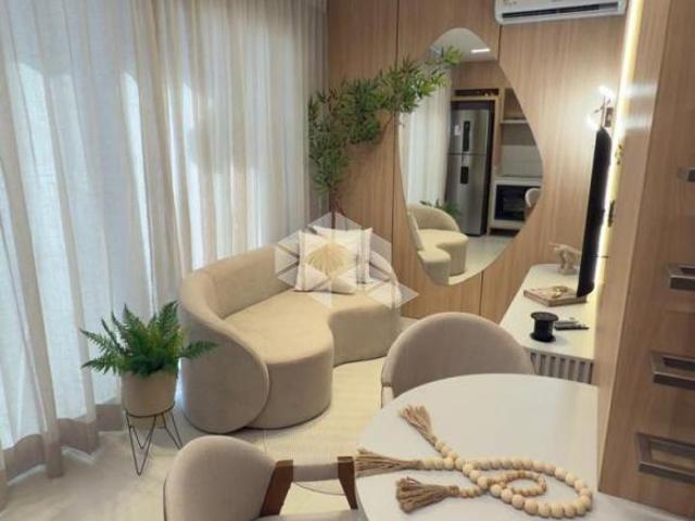 Apartamento de 1 dormitório mobiliado com terraço e vaga de garagem em Capão da Canoa