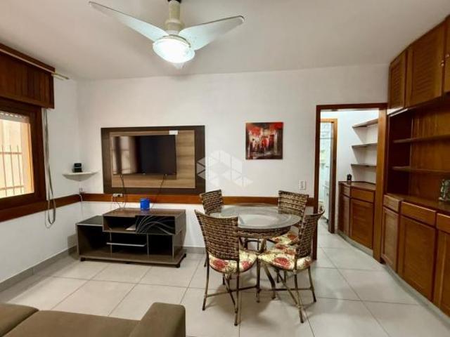 Apartamento de 1 dormitório mobiliado com box/vaga de garagem no Centro de Capão
