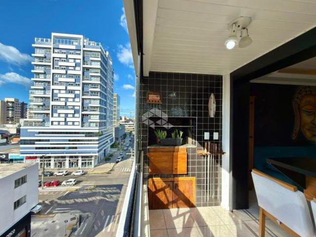 Apartamento de 2 dormitórios mobiliado com sacada de frente e box/vaga de garage