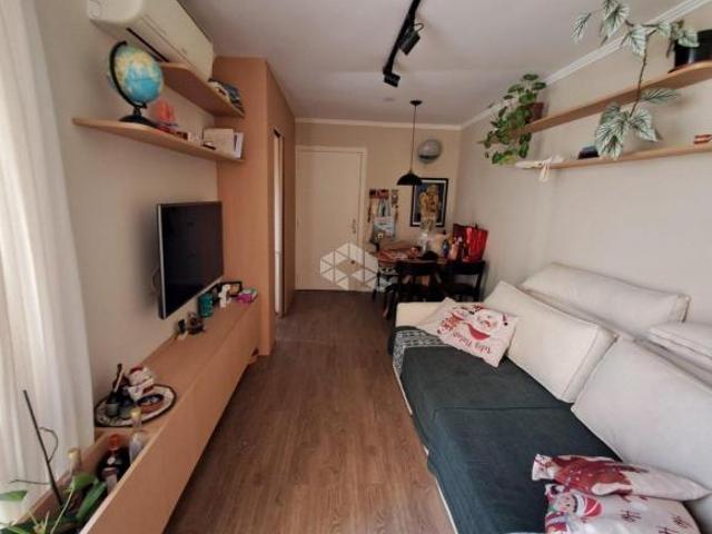 Apartamento de 2 dormitórios com escritório e vaga.
