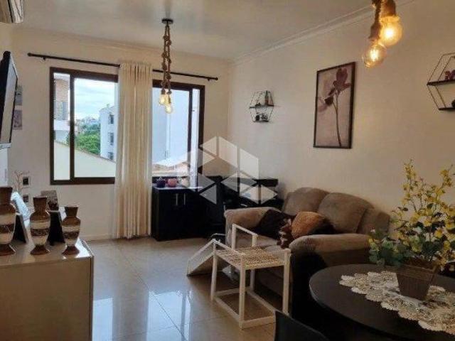 Apartamento de 2 dormitórios com suíte, elevador e garagem coberta no bairro Menino Deus
