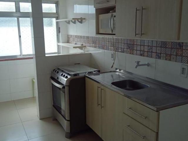 Apartamento de 2 dormitórios reformado com garagem escriturada fechada,área privativa de 60,65