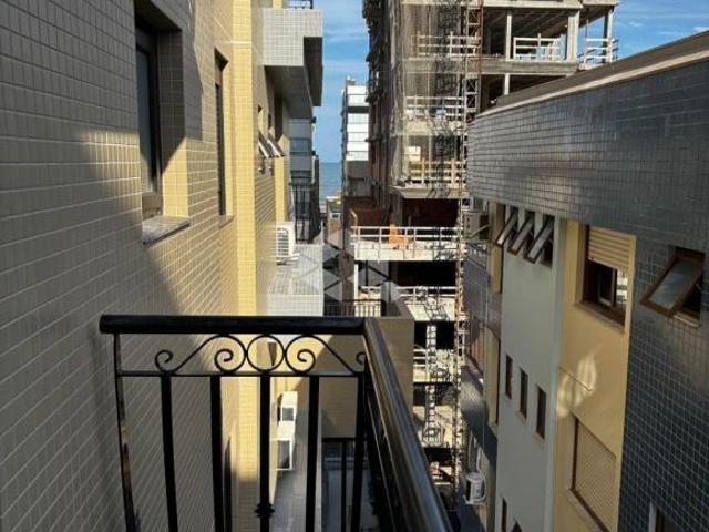 Apartamento de 2 dormitórios sendo 1 suíte com sacada e vaga de garagem em Capão