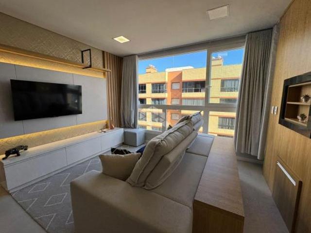 Apartamento de 2 dormitorios sendo 1 suite mobiliado com vaga de garagem em Capã