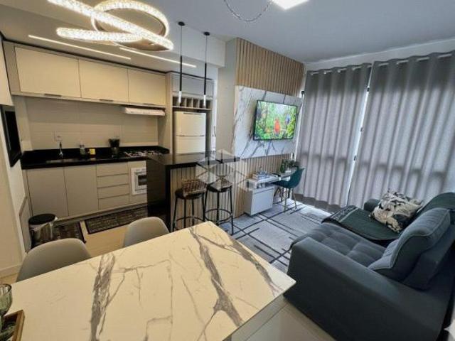 Apartamento de 2 dormitórios sendo 1 suíte mobiliado com bxo/vaga de garagem em Capão da Canoa