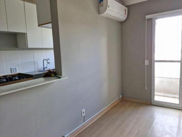 Apartamento de 2 dormitórios sendo 1 suíte, sala cozinha e garagem