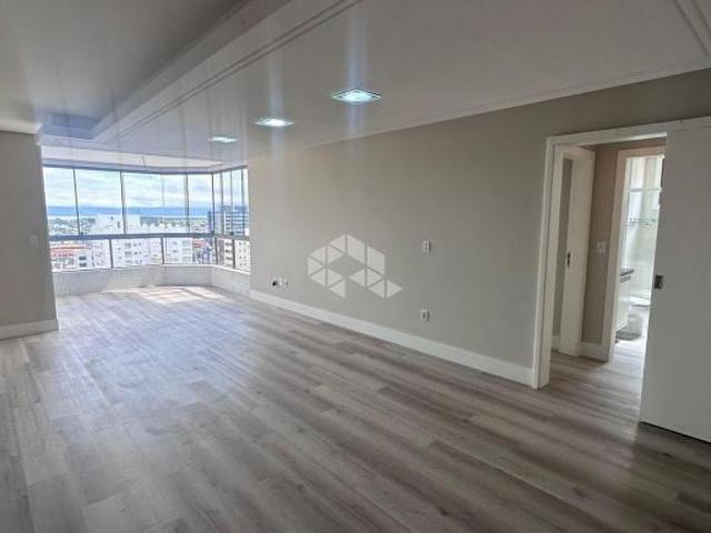 Apartamento de 2 dormitórios sendo 1 suíte semi mobiliado no Centro de Capão da Canoa