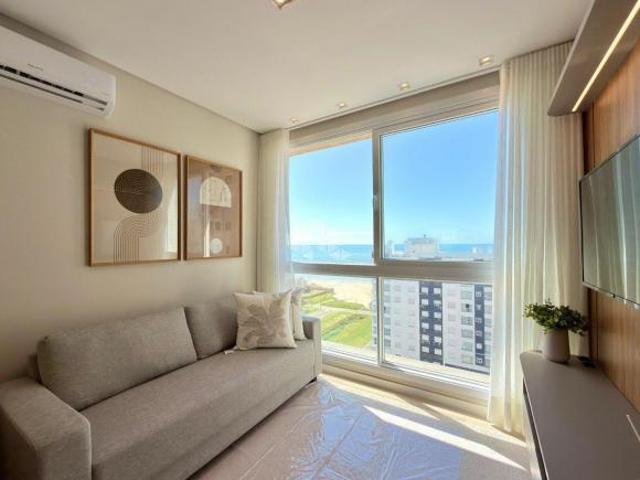 Apartamento de 2 dormitórios 1 suíte mobiliada com Vista Mar com box/vaga de gar