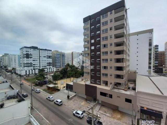 Apartamento de 2 dormitórios 1 suíte mobiliado com sacada e box/vaga de garagem em Capão da Canoa