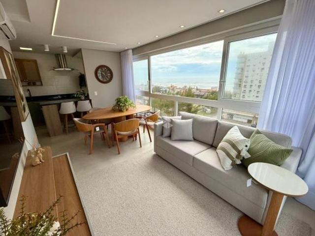 Apartamento de 3 dormitórios, mobiliado e decorado, vista para o mar e com box/vaga de garagem na Zo
