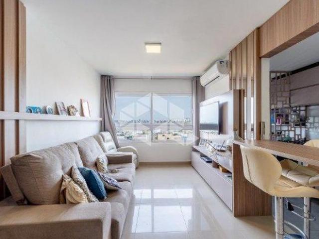 Apartamento de 3 dormitórios com suíte e 2 vagas de garagem no bairro São João em Porto Alegre