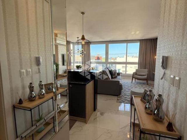 Apartamento de 3 dormitórios sendo 1 suíte mobiliado e com box/vaga de garagem em Capão da Canoa