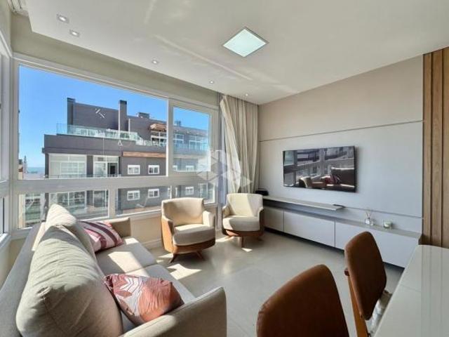 Apartamento de 3 dormitórios sendo 1 suíte mobiliado L/N com box de garagem na Zona Nova em Capão da