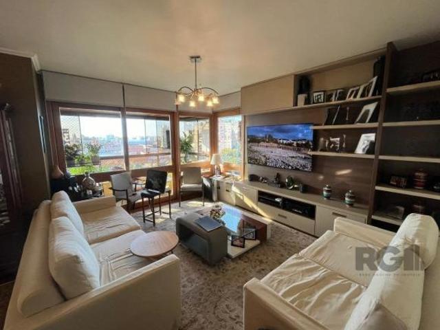 Apartamento de três dormitórios, suíte, sacada com churrasqueira e duas vagas de