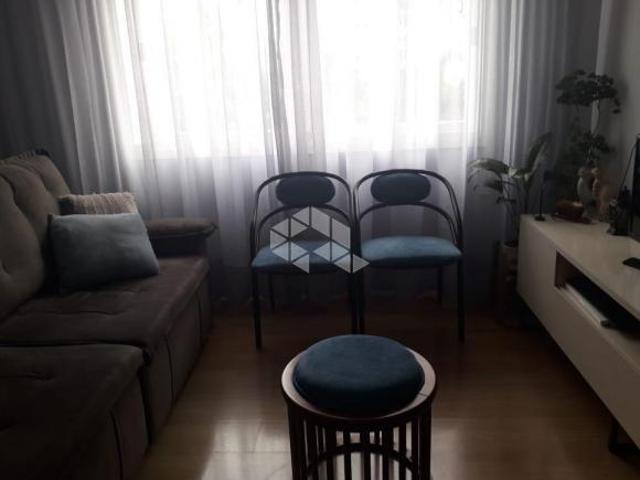 Apartamento dois dormitórios com garagem, sacada e elevador, 75m² área privativa no bairro Menino D
