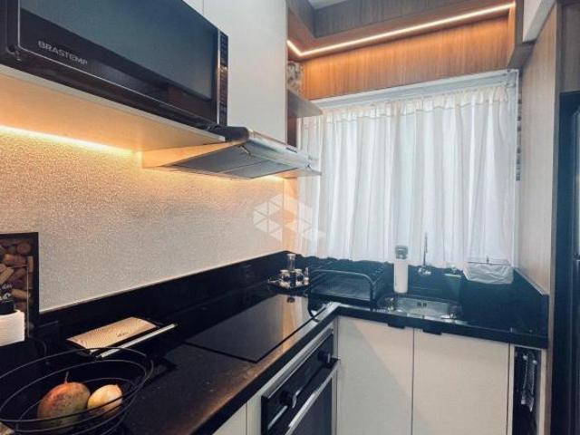 Apartamento dois dormitórios com sacada e suíte semi mobiliado